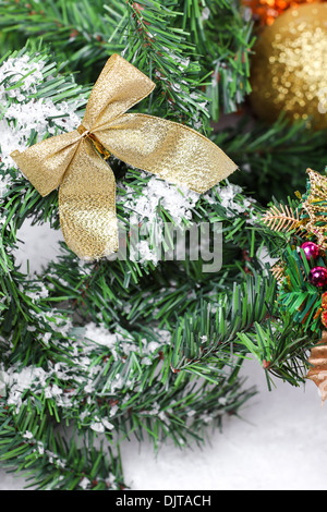 Decoration golden billow on new year tree branch in snow Stock Photo ...