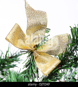 Decoration golden billow on new year tree branch in snow Stock Photo ...