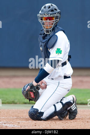 Notre Dame Fighting Irish catcher Mark Quatrani (19) and umpire Adam ...