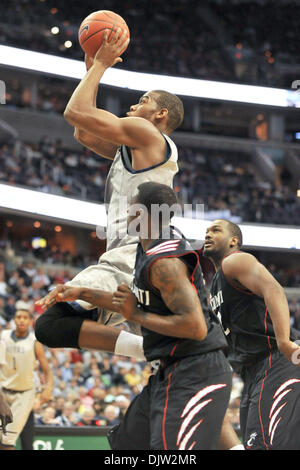Georgetown center Greg Monroe (10) tries pick up the loose ball from ...