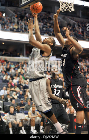 Georgetown center Greg Monroe (10) works the ball into the lane against ...