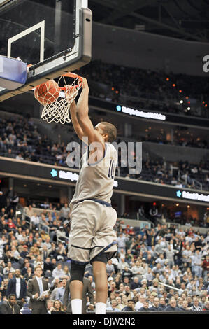 Georgetown center Greg Monroe #10 watches for opportunity around ...