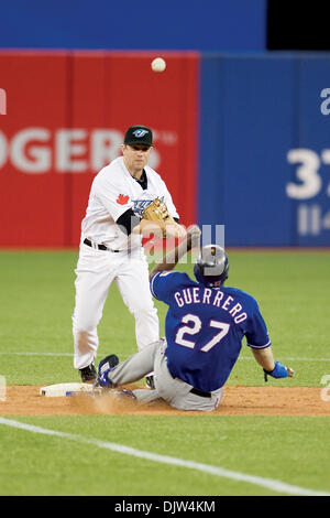 Toronto Blue Jays' Vladimir Guerrero Jr. reacts after being hit by a ...