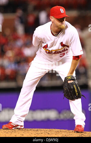 St. Louis Cardinals pitcher Ryan Fernandez makes an error as he throws ...