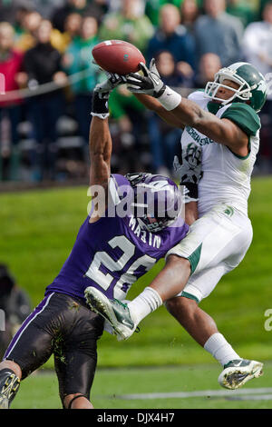 Northwestern cornerback Jordan Mabin (26) breaks up a pass intended for ...