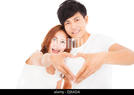 Young lovely couple making heart with hands at home Stock Photo - Alamy
