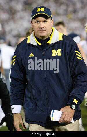 Michigan head coach Rich Rodriguez walks in front of his players after ...