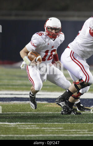 Miami (Ohio) quarterback Austin Boucher (16) is chased down by Illinois ...