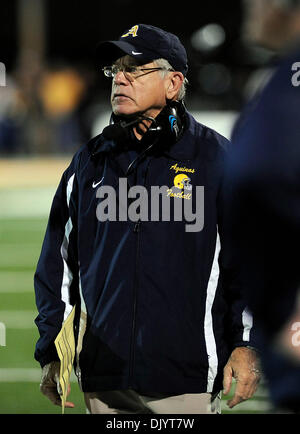 St. Thomas Aquinas head coach Roger Harriott, hugs NFL Academy head ...