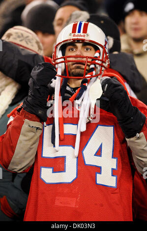 A New England Patriots fan cheers during the first half of an NFL ...