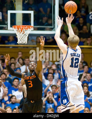 Kyle Singler of Duke (12) shoots over Andrew Smith of Butler (44 ...