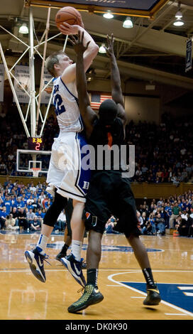 Kyle Singler of Duke (12) shoots over Andrew Smith of Butler (44 ...
