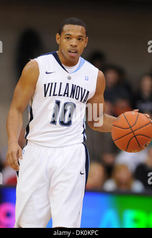 Villanova guard Corey Fisher (10) tries to hold back instead of driving ...