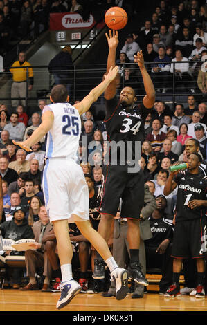 Cincinnati Forward Yancy Gates (34) grabs rebound in first half game ...