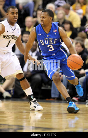 Duke guard Tyler Thornton (3) and Wake Forest center Carson Desrosiers ...