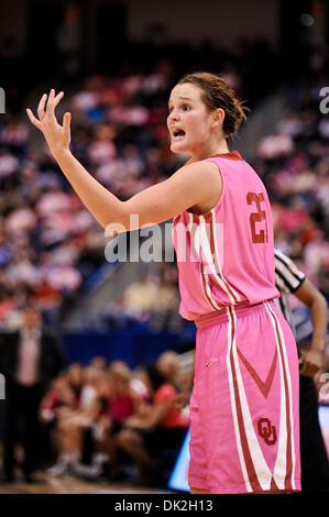 Oklahoma guard Whitney Hand (25) is helped off the court by strength ...