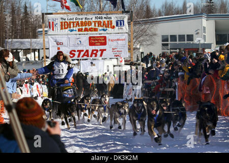 Four-time Iditarod champion Martin Buser drives his dog team up the ...