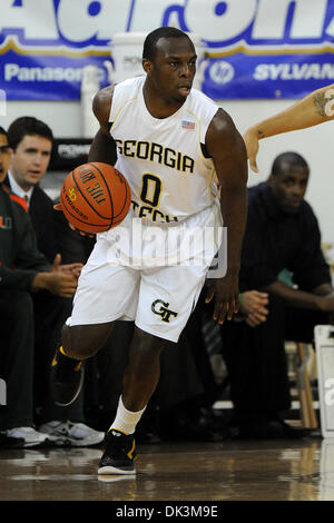 Georgia Tech guard Mfon Udofia drives over Maryland gurad Sean Mosley ...