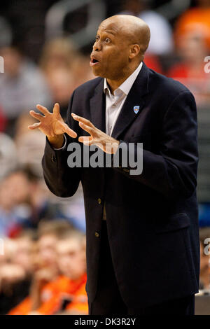 Oregon State Beavers head coach Mitch Canham (11) talks with umpire ...