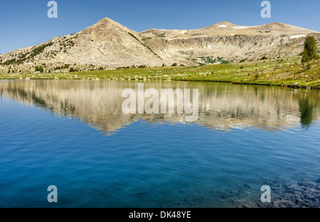 Granite mountain reflecting off of Middle Gaylor Lake.Yosemite National ...