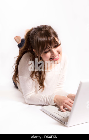 Smiling girl laying on the floor wearing aviator glasses and hat Stock ...