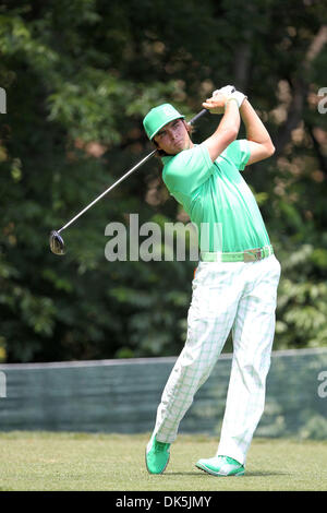 Rickie Fowler watches his tee shot on the 18th hole during the second ...