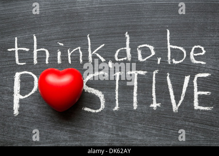think positive concept handwritten on black chalkboard Stock Photo - Alamy