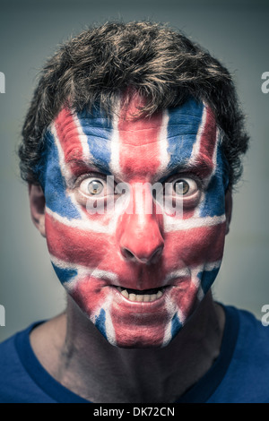 Portrait of spooky man with British flag painted on face Stock Photo ...