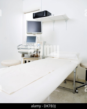 Modern ultrasound machine, chair and examination bed in clinic Stock ...