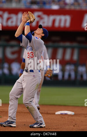 Chicago Cubs second baseman James Triantos, right, throws to first to ...