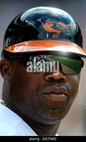 Cincinnati Reds first base coach Collin Cowgill (54) sits in the dugout ...
