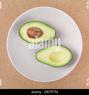Two ripe Avocado over wooden background Stock Photo - Alamy