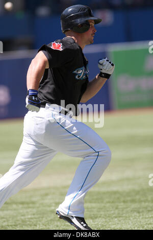 Toronto Blue Jays' Travis Snider scores against the Cleveland Indians ...