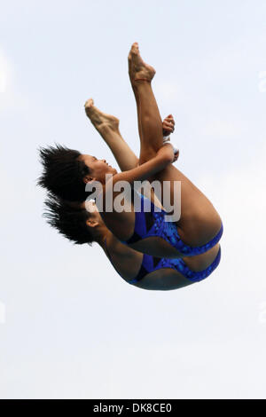 Wang Hao and Chen Ruolin of China huge each other after finishing first ...