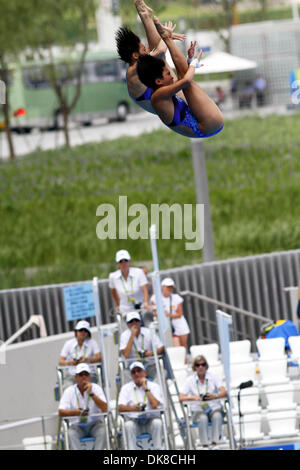 Wang Hao and Chen Ruolin of China huge each other after finishing first ...