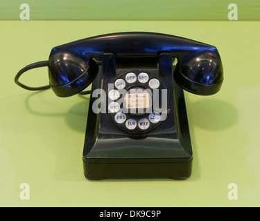Vintage rotary telephone on a desk. Still life with retro phone. Bright ...