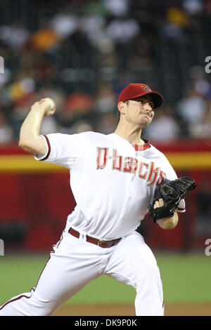 Arizona Diamondbacks starting pitcher Chase Anderson, right, hands the ...