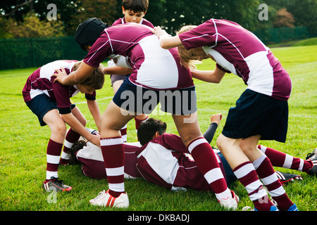 Teenage boys playing a game of rugby, physical education sport and ...