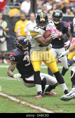 Pittsburgh Steelers running back Mewelde Moore, top, is brought down by ...