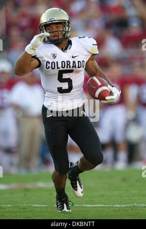 Colorado running back Rodney Stewart (5) is tackled by USC safety T.J ...