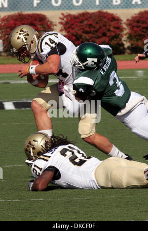 Western Michigan' quarterback Alex Carder, center, dives for the end ...