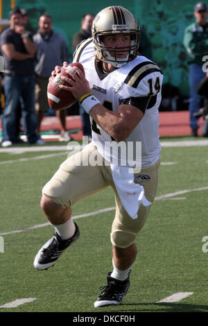 Western Michigan' quarterback Alex Carder, center, dives for the end zone through the defense of ...