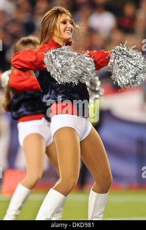 A New England Patriots cheerleader performs during the second half an ...