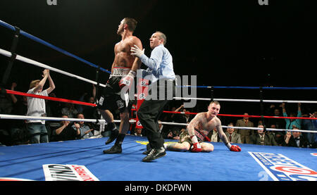 Jan 12, 2007; Minneapolis, MN, USA; MATT VANDA, left, takes a hit from ...