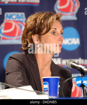 Duke head coach Gail Goestenkors (right) gets her hair fixed by ...