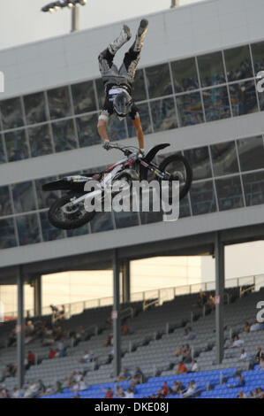 Professional rider at the FMX (Freestyle Motocross) make an acrobatic ...