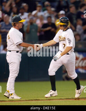 Seattle Mariners third base coach Kristopher Negron cools off in the ...