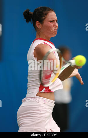 Sybille Bammer from Austria returns a ball to Italy's Francesca ...