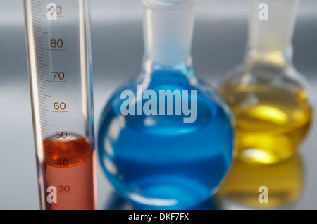 Chemical lab glassware: graduated cylinder, small beaker, beaker with ...