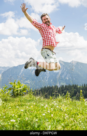 Portrait of a young man mid-air Stock Photo - Alamy
